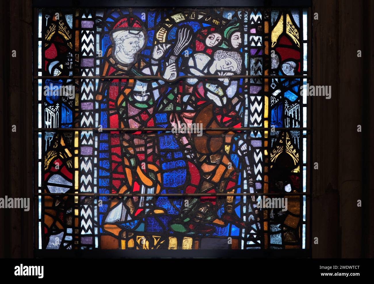 Medieval stained glass window, of a penitencer with whip, in the ...