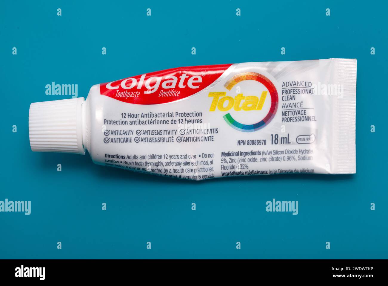 Colgate Total Toothpaste tube on blue background Stock Photo - Alamy