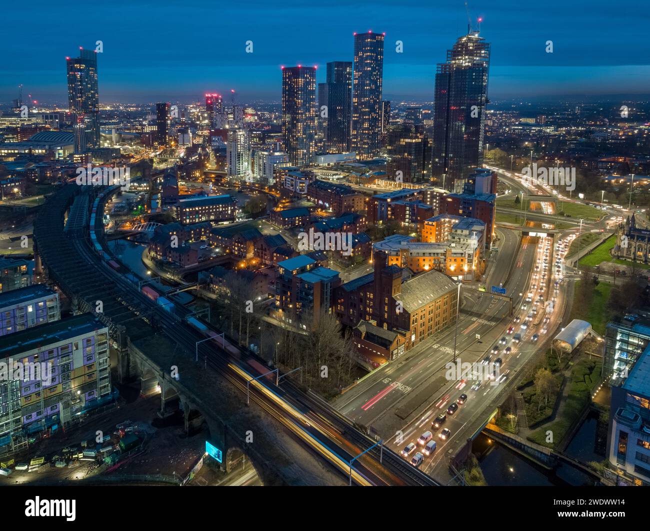 Twilight aerial photograph at rush hour of Mancunian Way, rail bridges ...