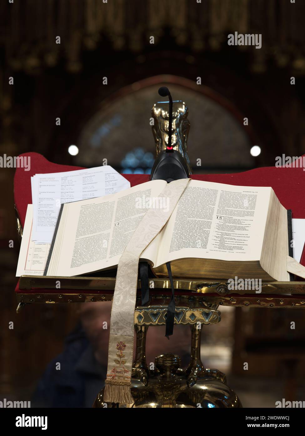 Open bible on a lectern in the quire of the medieval english cathedral ...