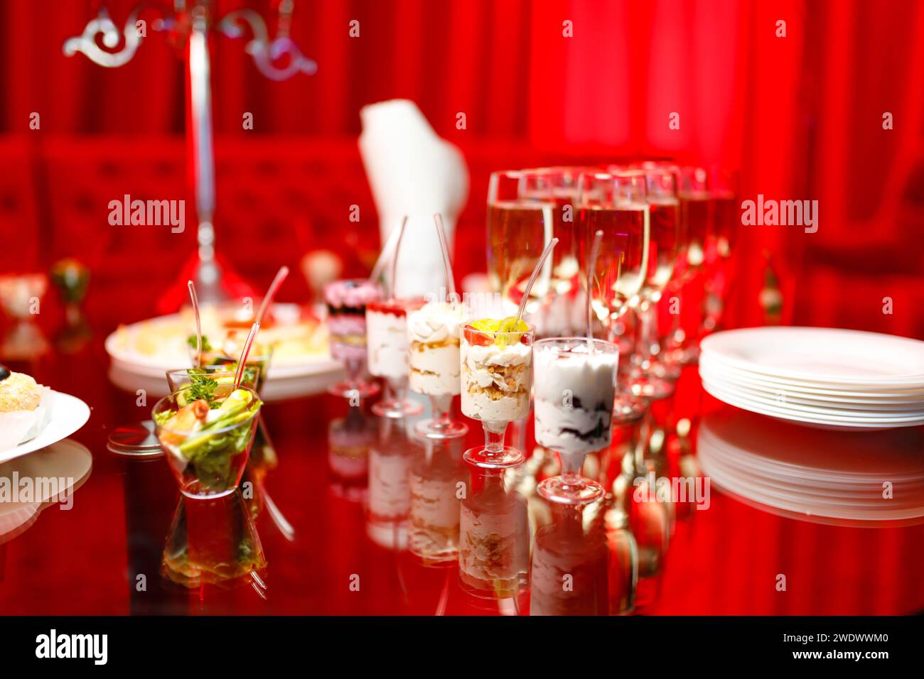 buffet table with toasts and snacks and desserts in red tones Stock ...
