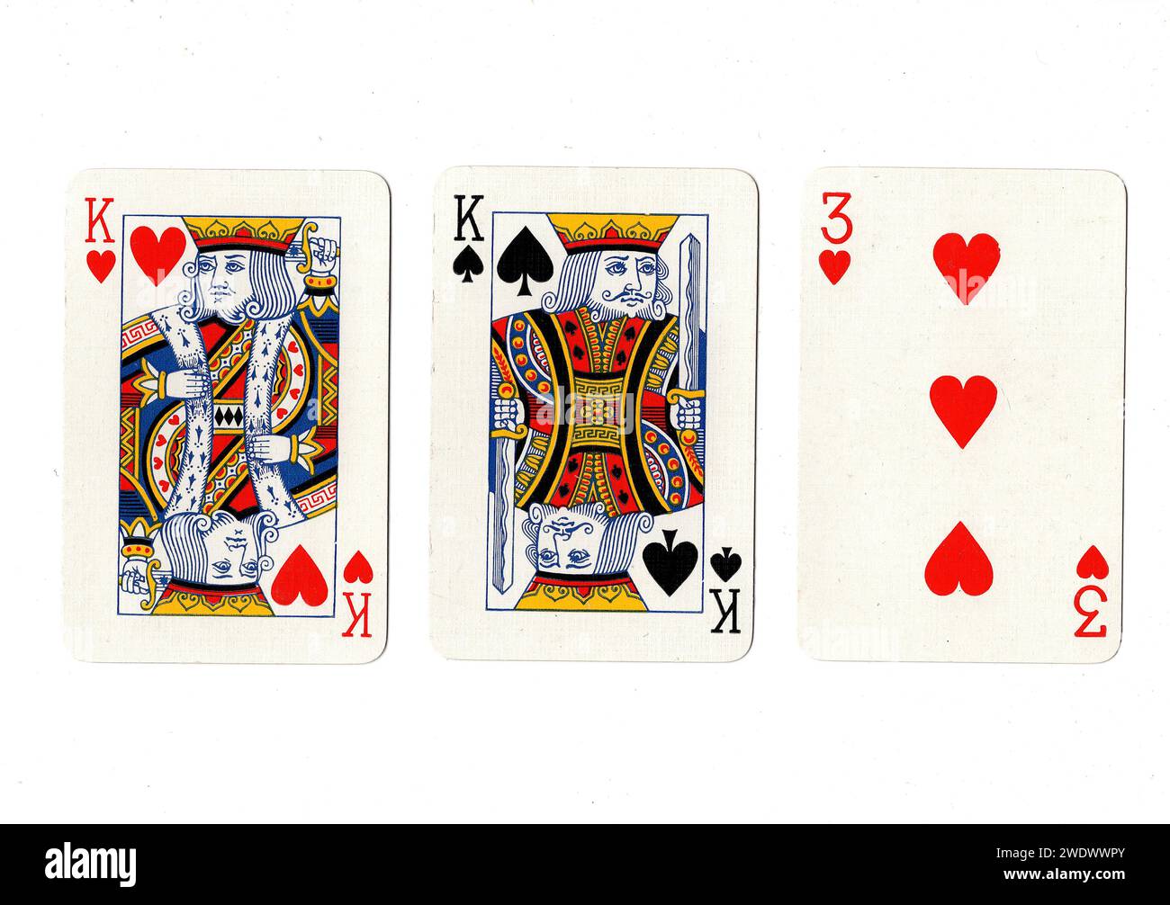 Vintage playing cards showing a pair of kings and a red three isolated ...