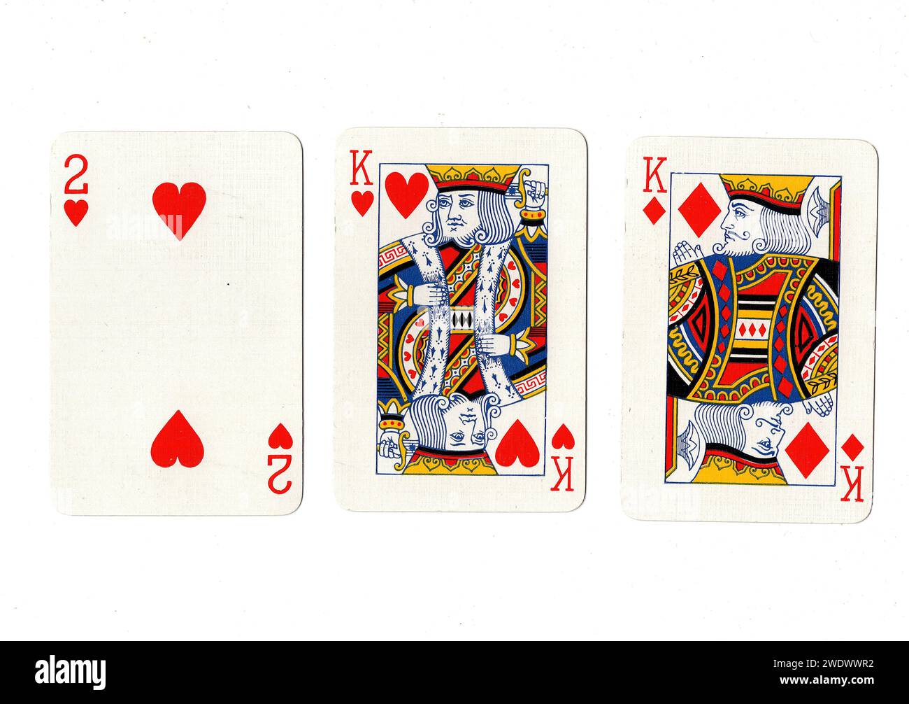 Vintage playing cards showing a pair of red kings and a red two ...