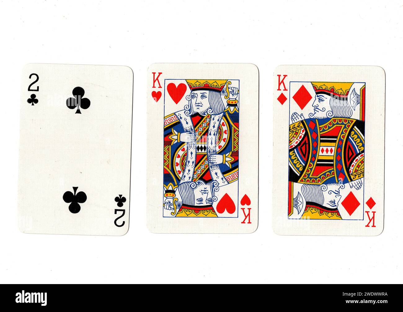Vintage playing cards showing a pair of red kings and a black two ...