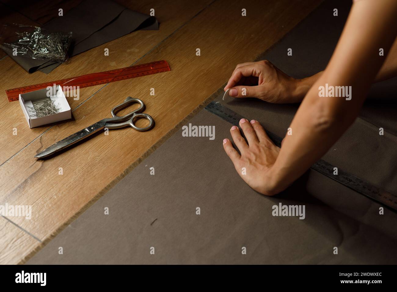tools fabric marking hands ruler seamstress Stock Photo - Alamy