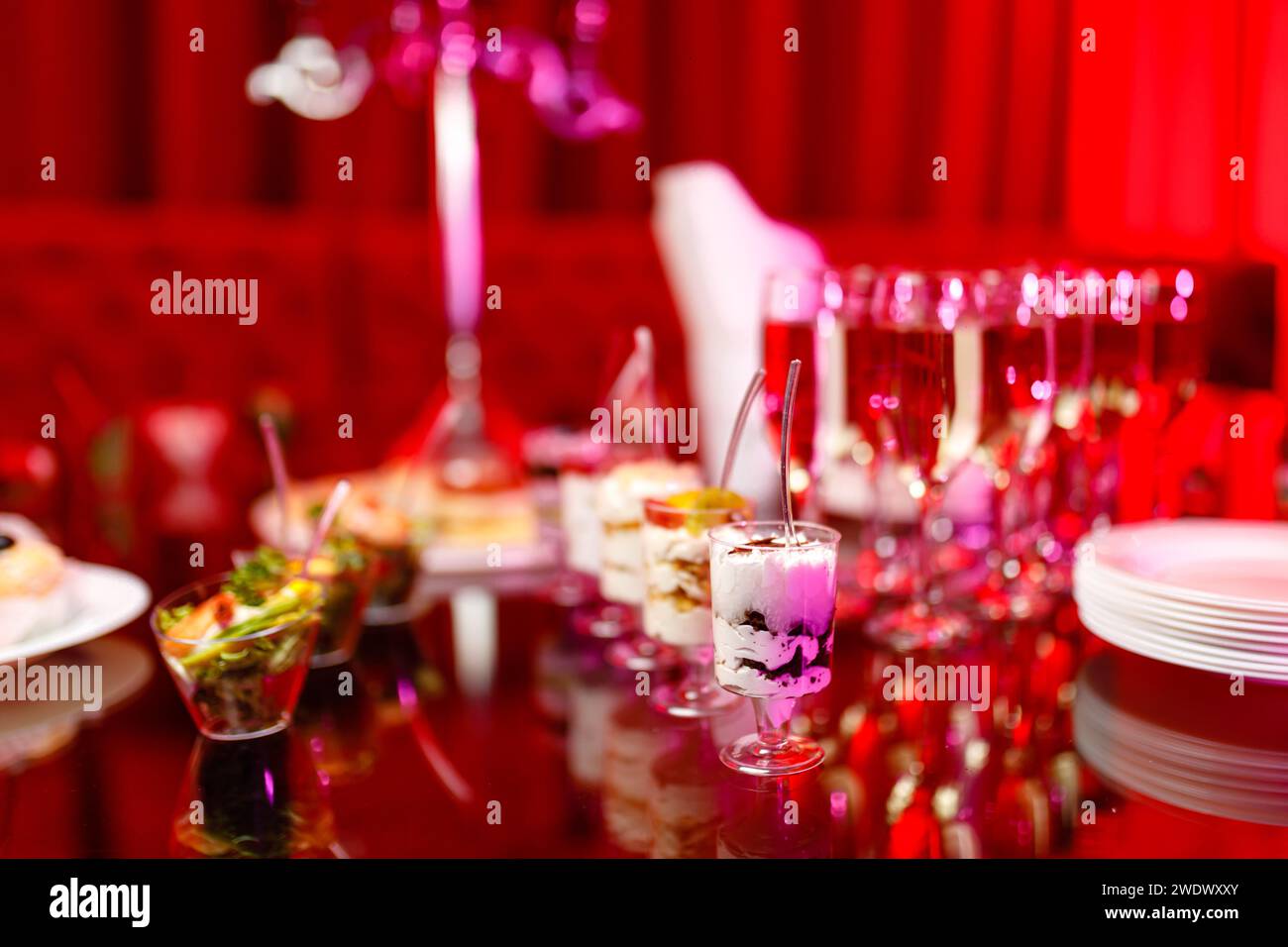 buffet table with toasts and snacks and desserts in red tones Stock ...