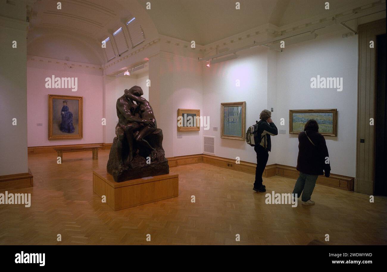 A bronze sculpture of Rodins The Kiss in one of the galleries of the ...
