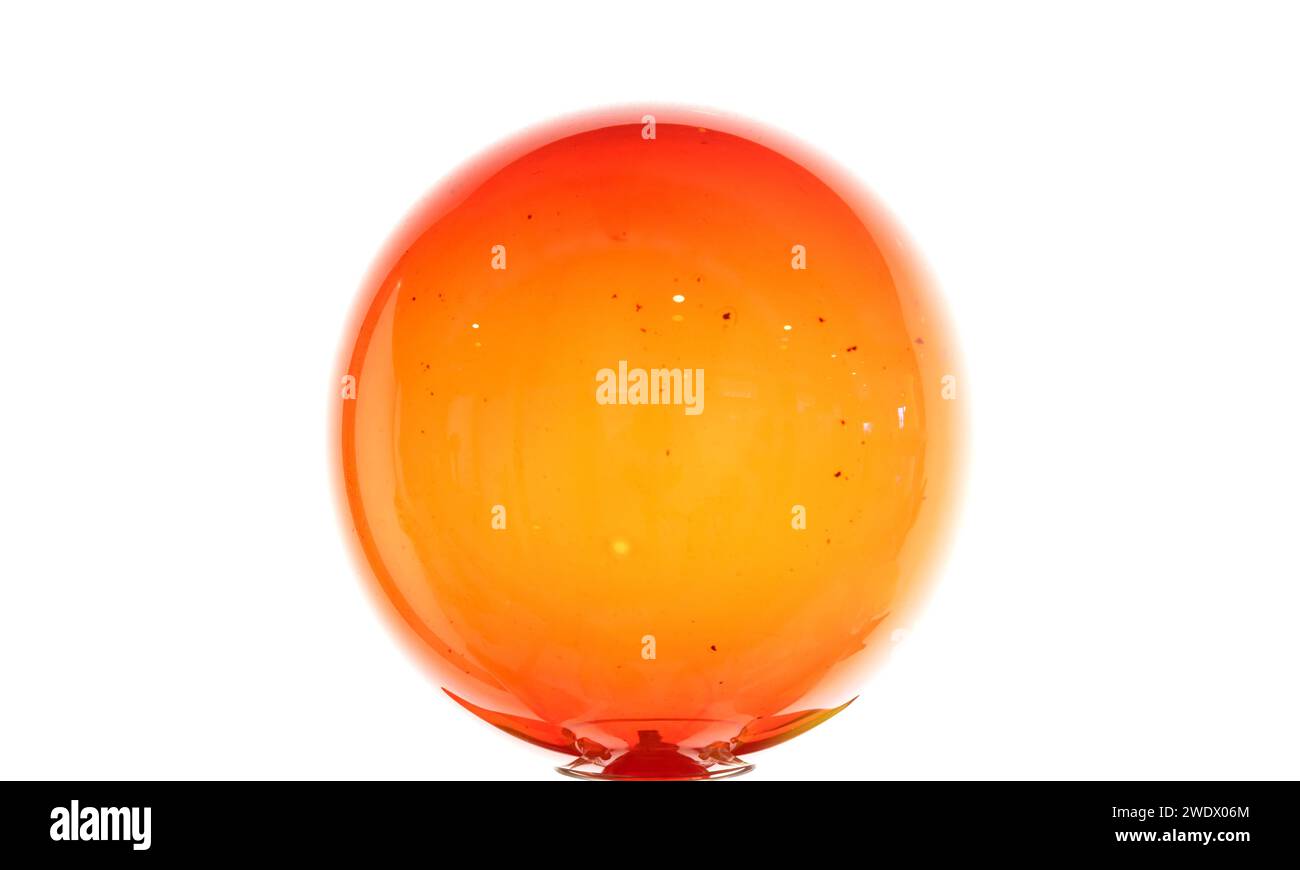 Abstract glass installation, red sphere isolated on white wall ...