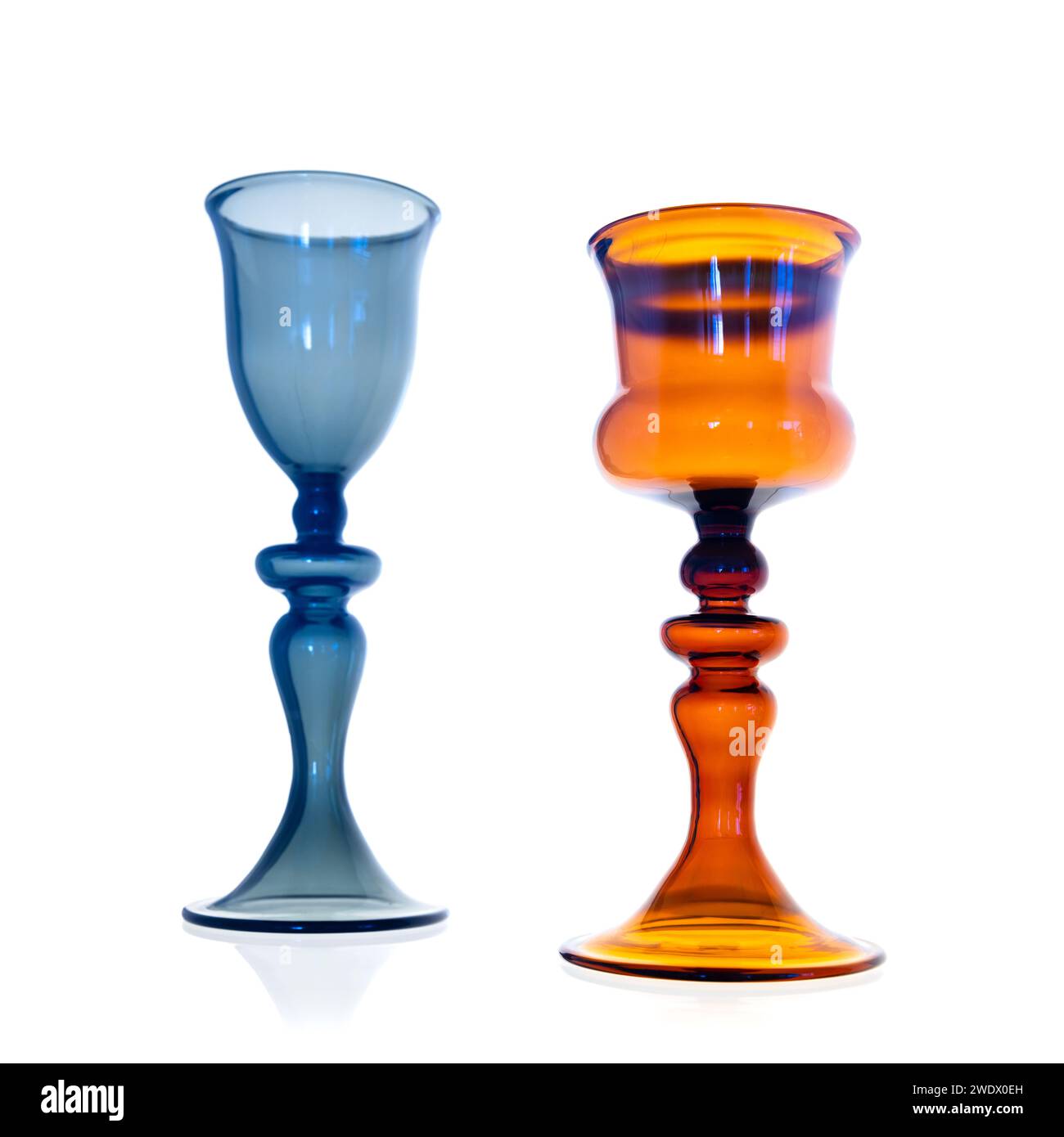 Two glass goblets isolated on white background, square studio shot ...