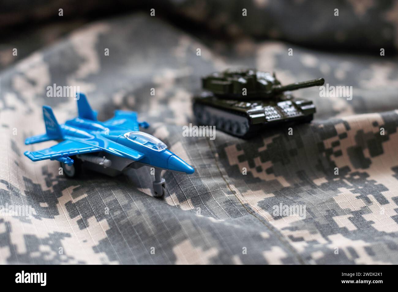 Toy tank with camouflage color . Military vehicles toy. Simple cheap ...