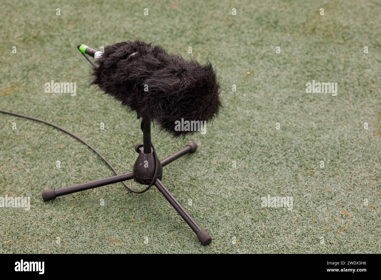 microphone on the ground football field Stock Photo - Alamy