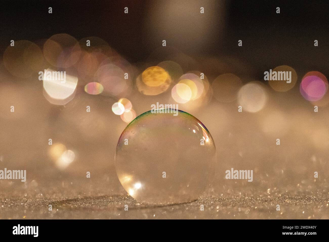 Bubbles sitting on a frosted covered surface Stock Photo - Alamy