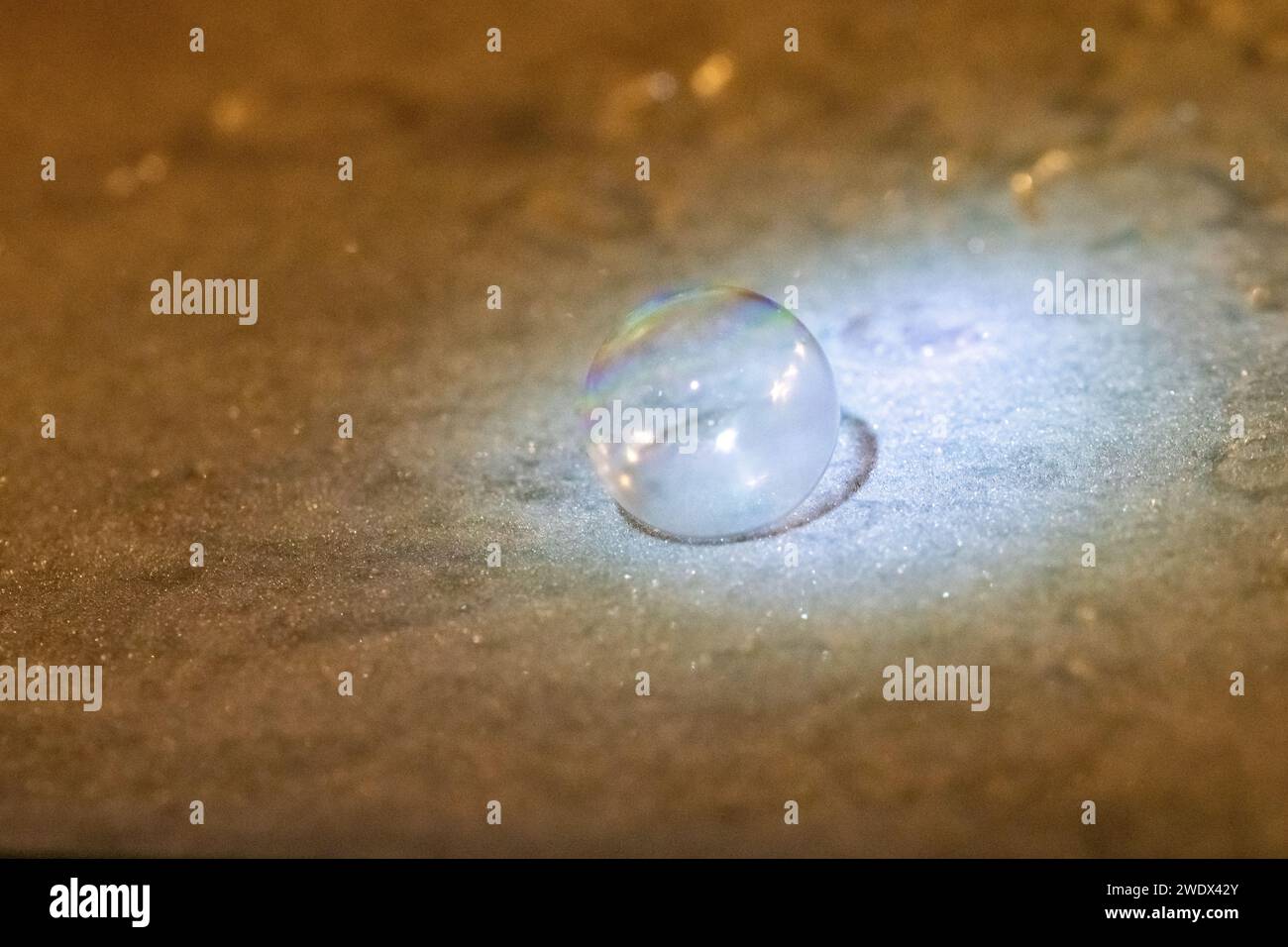 Bubbles sitting on a frosted covered surface Stock Photo - Alamy