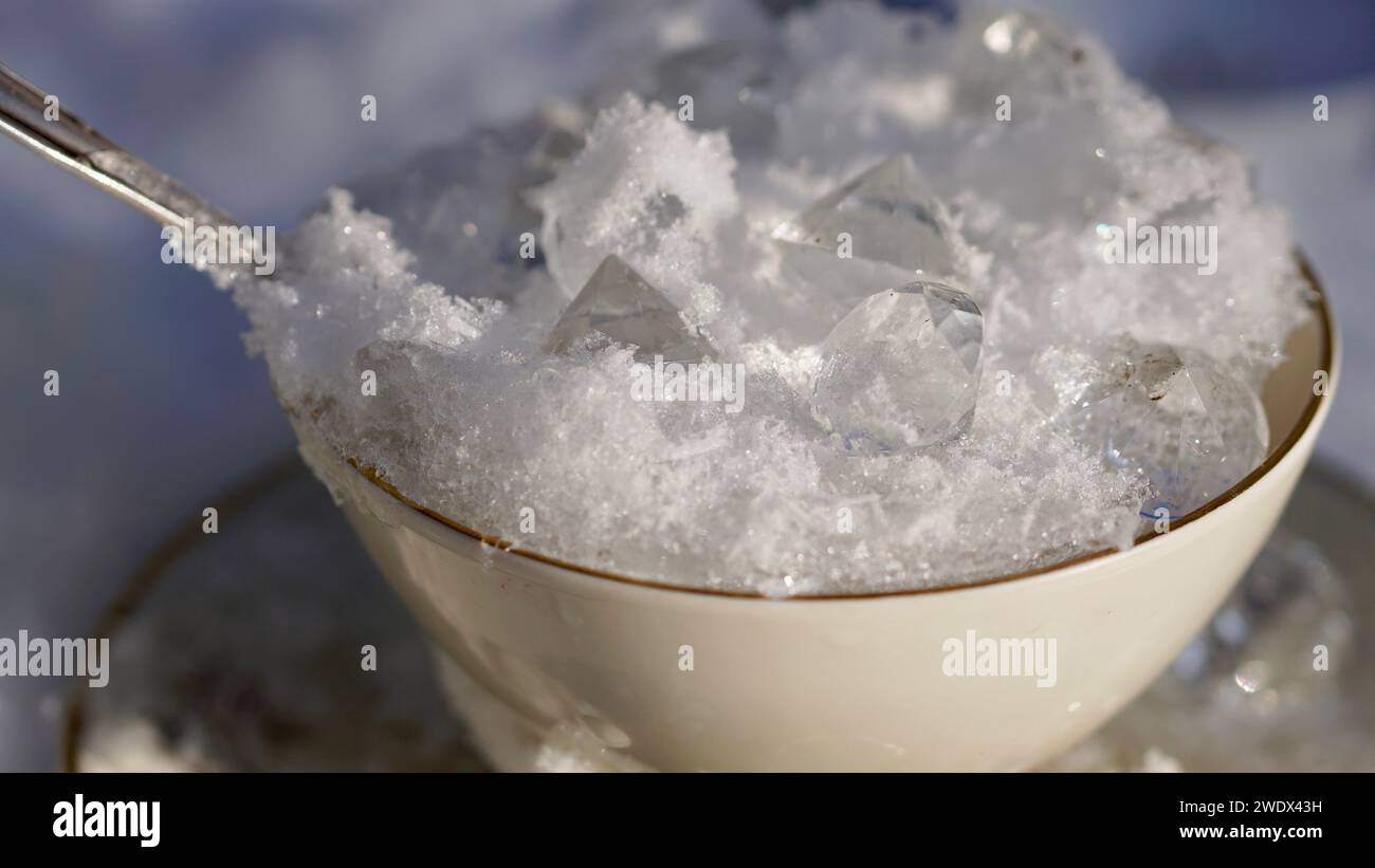 A cup filled with ice, snow and glass crystals. Ice tea, ice coffee ...
