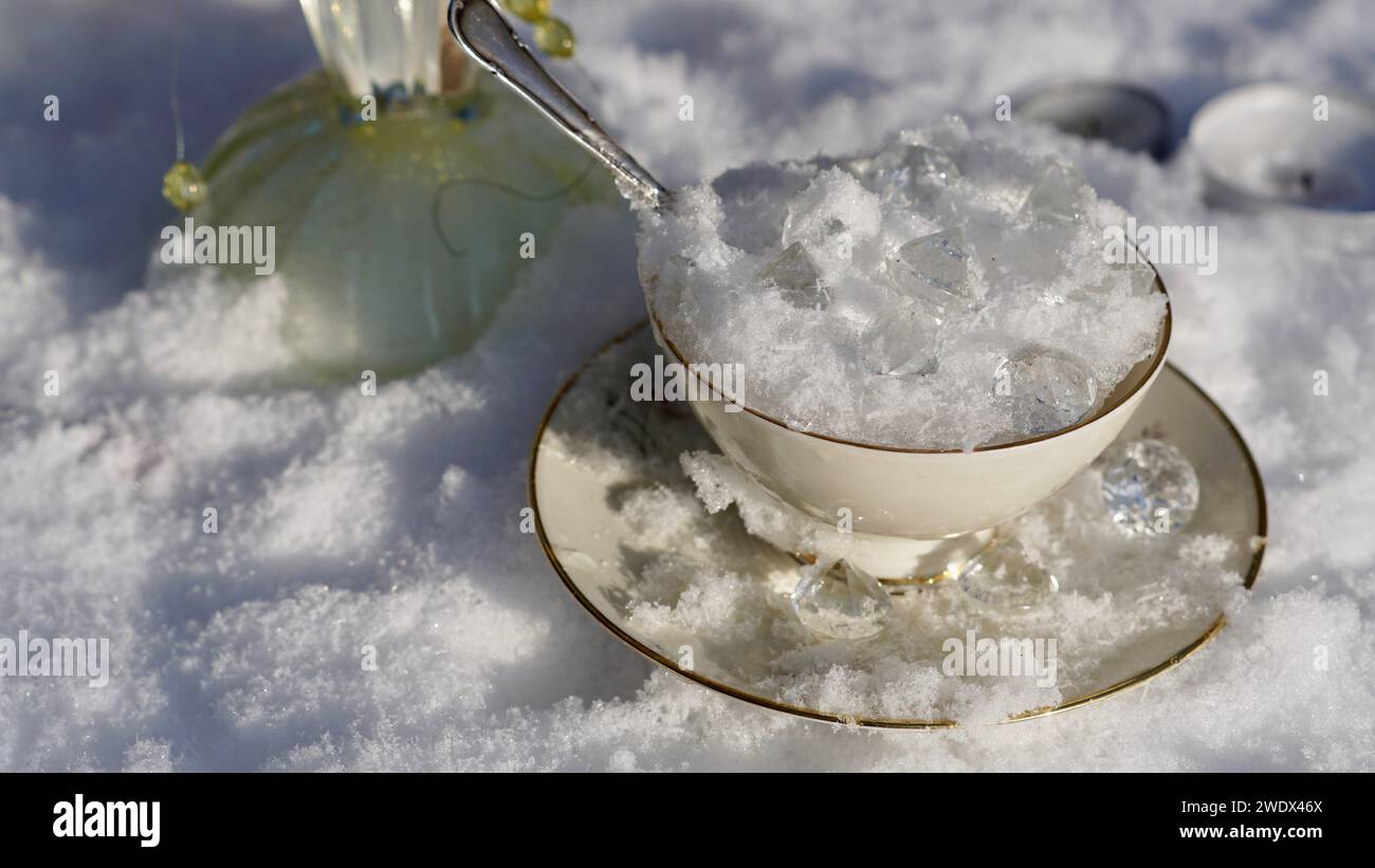A cup filled with ice, snow and glass crystals. Ice tea, ice coffee ...