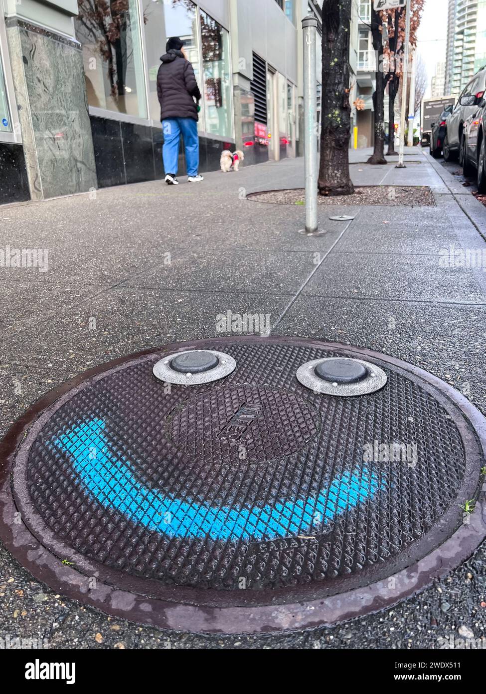 Seattle, USA. 22nd Dec, 2024. Graffiti and eyes on a manhole downtown ...