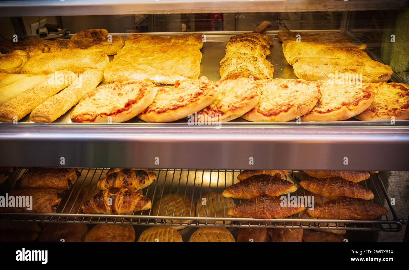 Freshly baked Focaccia al formaggio di Recco on a shelf in a ...
