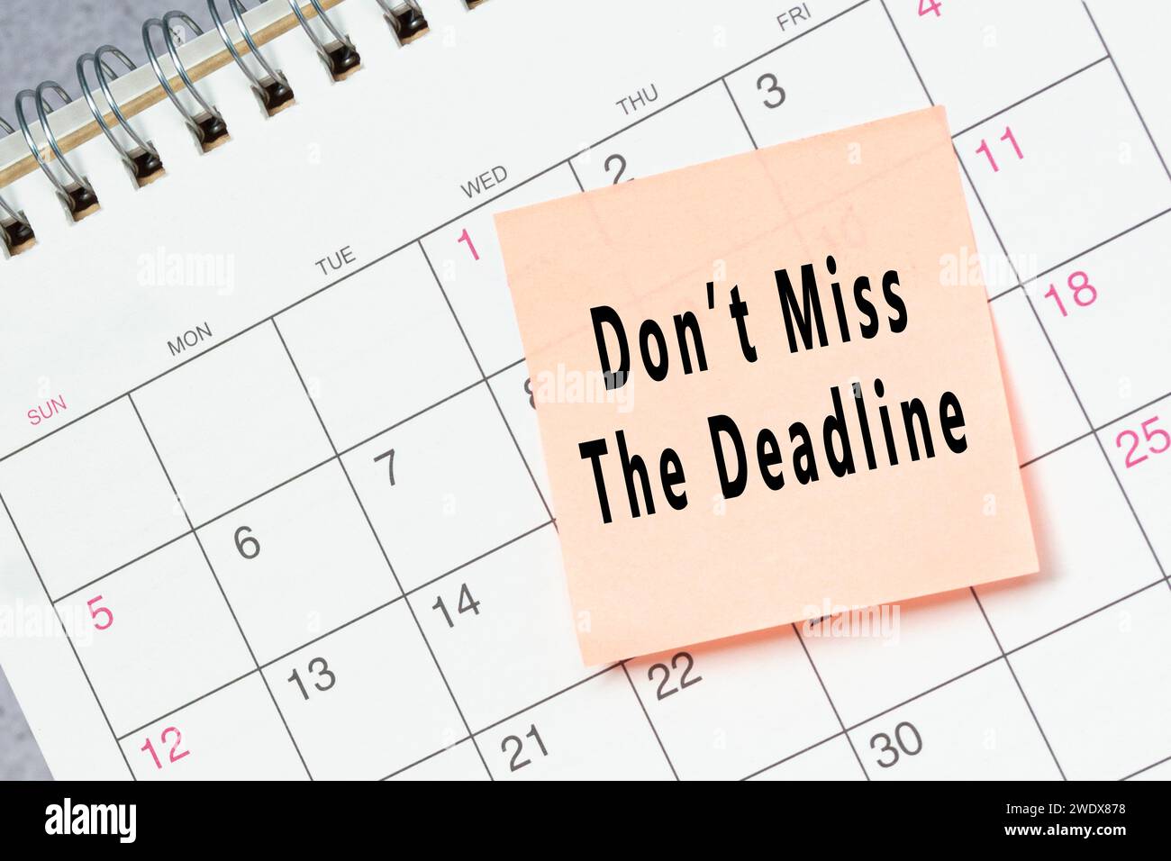 Dont miss the deadline text on sticky note on a calendar. Business ...