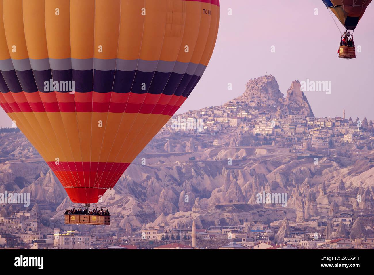 Hot air balloon flight in Goreme in Turkey during sunrise. Ride in a ...