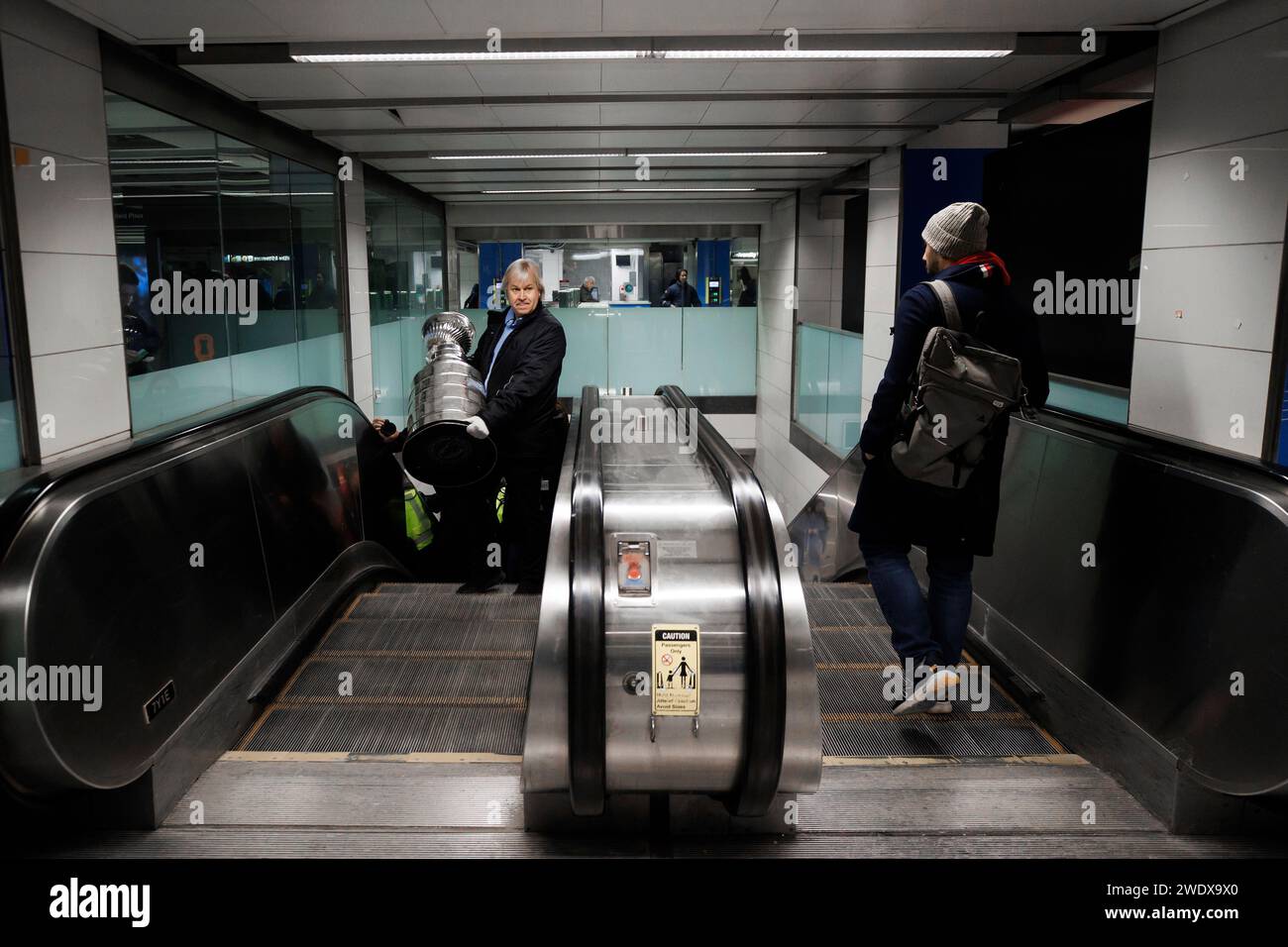 Phil Pritchard, keeper of the Cup, carries the Stanley Cup to a photo ...