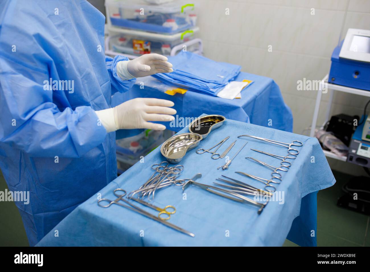 sterile instruments for surgery on the tray and hands. High quality ...