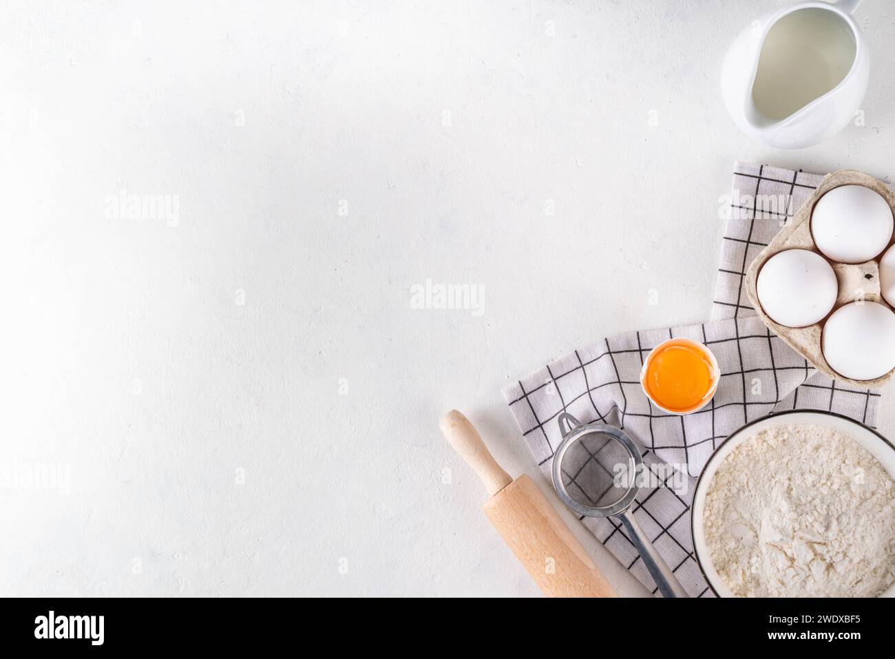 Empty space baking background with bakery ingredients - flour, milk ...