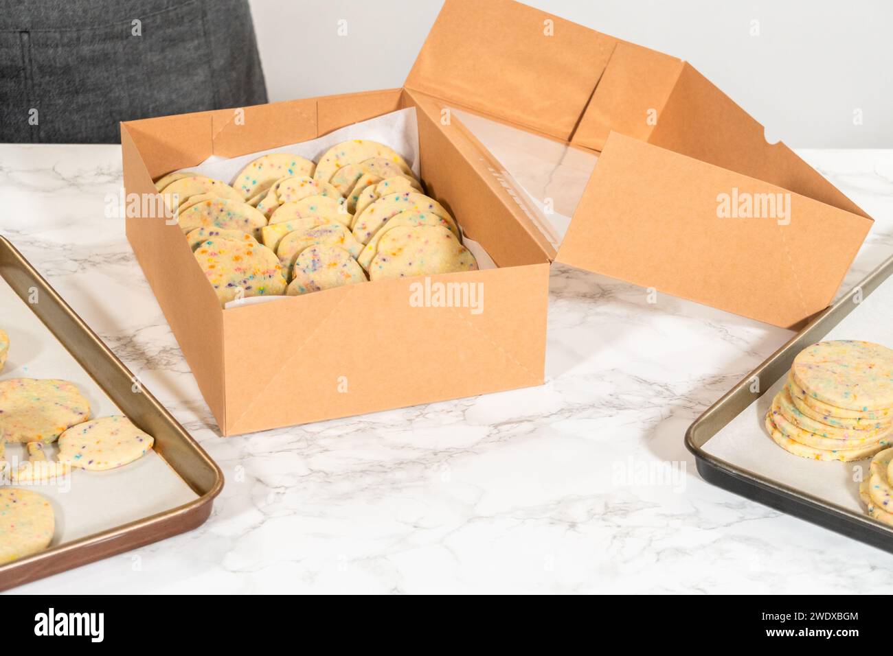 Packing Sprinkle-Adorned Sugar Cookies into Boxes Stock Photo - Alamy