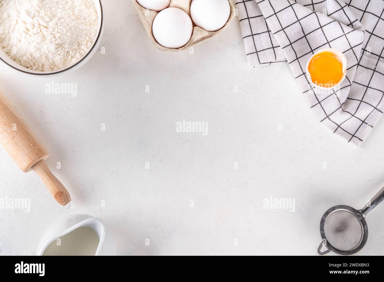 Empty space baking background with bakery ingredients - flour, milk ...