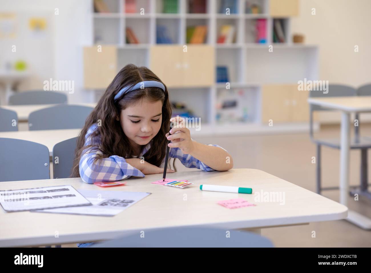 Child doing activity in classroom hi-res stock photography and images ...