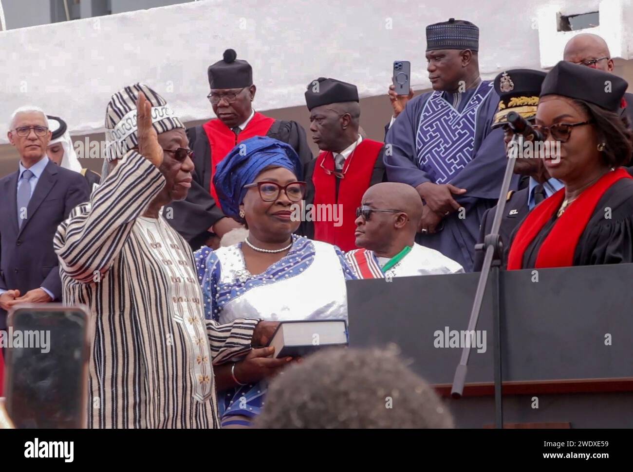 In this picture taken from video, Liberia's new President Joseph Nyuma Boakai, front left, is ...