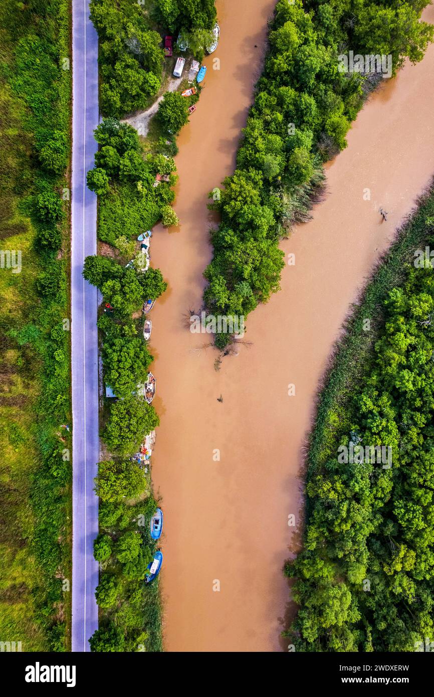 Fishing boats at the Delta of Pineios river, muddy after recent ...