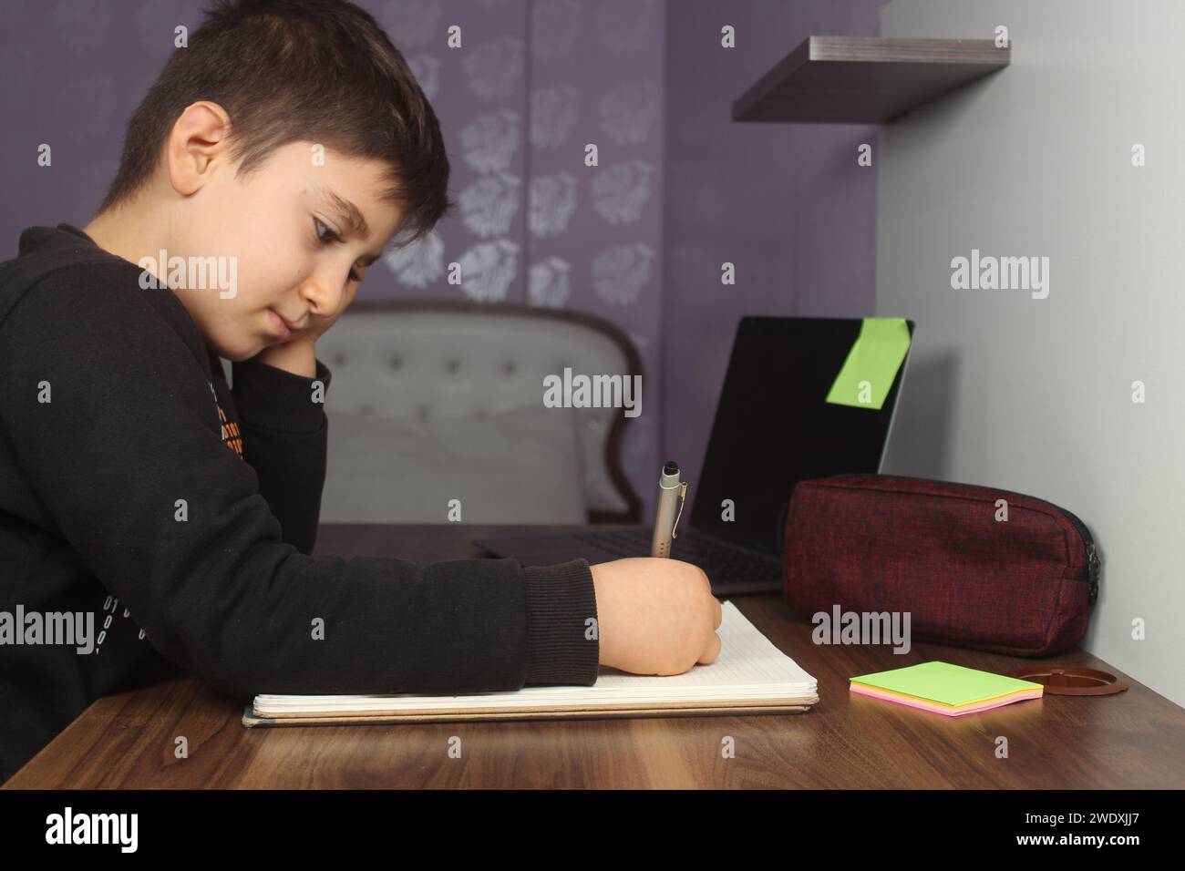 Child portrait write homework hi-res stock photography and images - Alamy