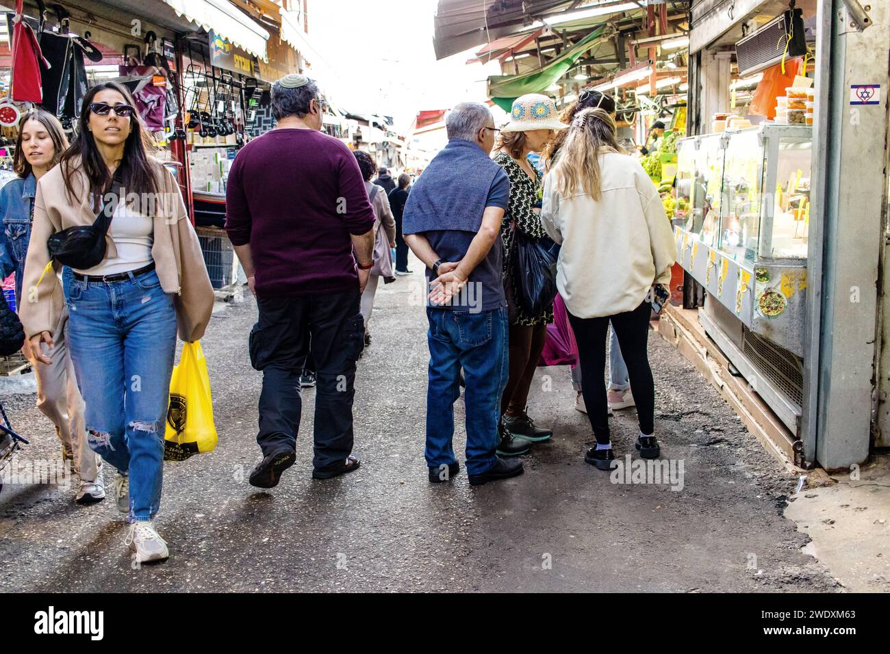 Tel Aviv, Israel - January 22, 2024 People shop at the Carmel market ...
