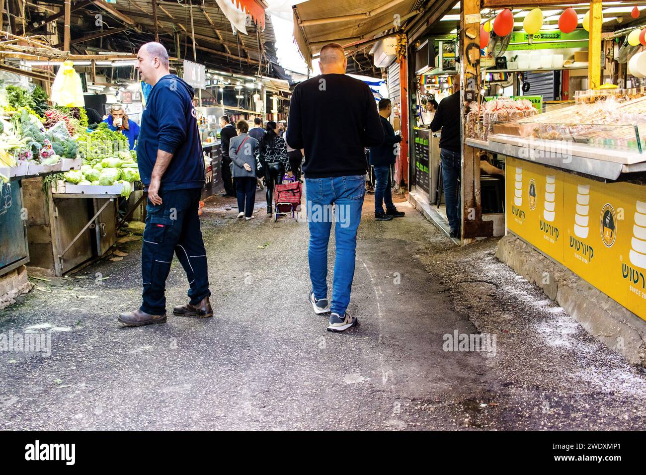 Tel Aviv, Israel - January 22, 2024 People shop at the Carmel market ...