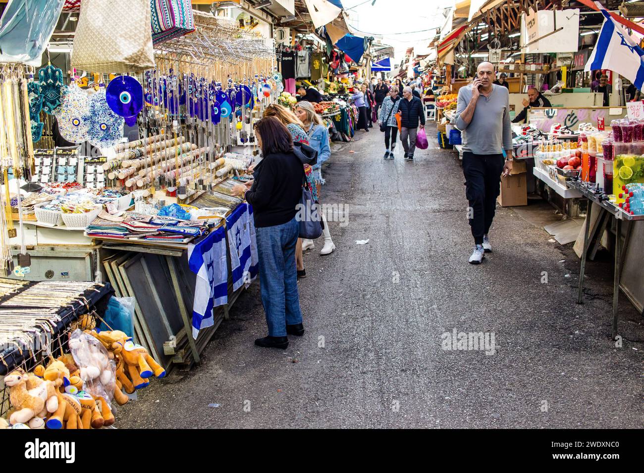 Tel Aviv, Israel - January 22, 2024 People shop at the Carmel market ...