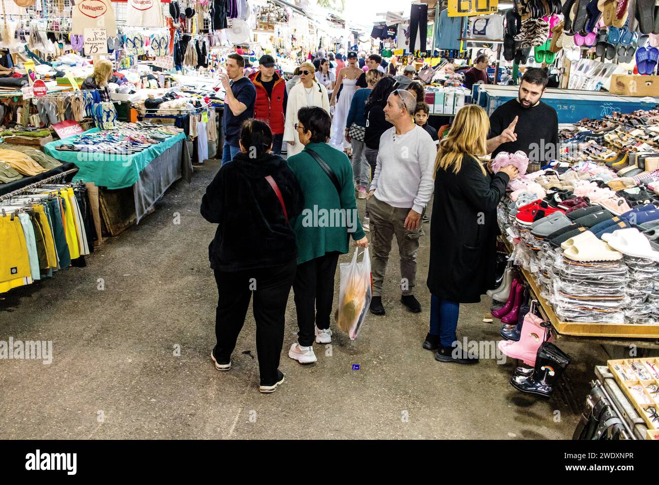 Tel Aviv, Israel - January 22, 2024 People shop at the Carmel market ...