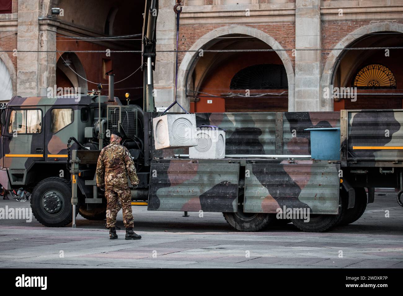 a military man loads a car with cargo. High quality photo Stock Photo - Alamy