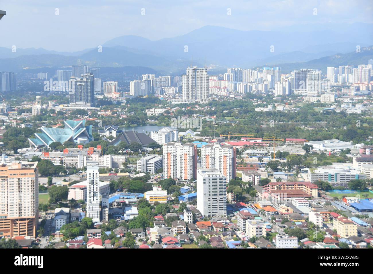 A panoramic cityscape featuring towering skyscrapers and a prominent ...