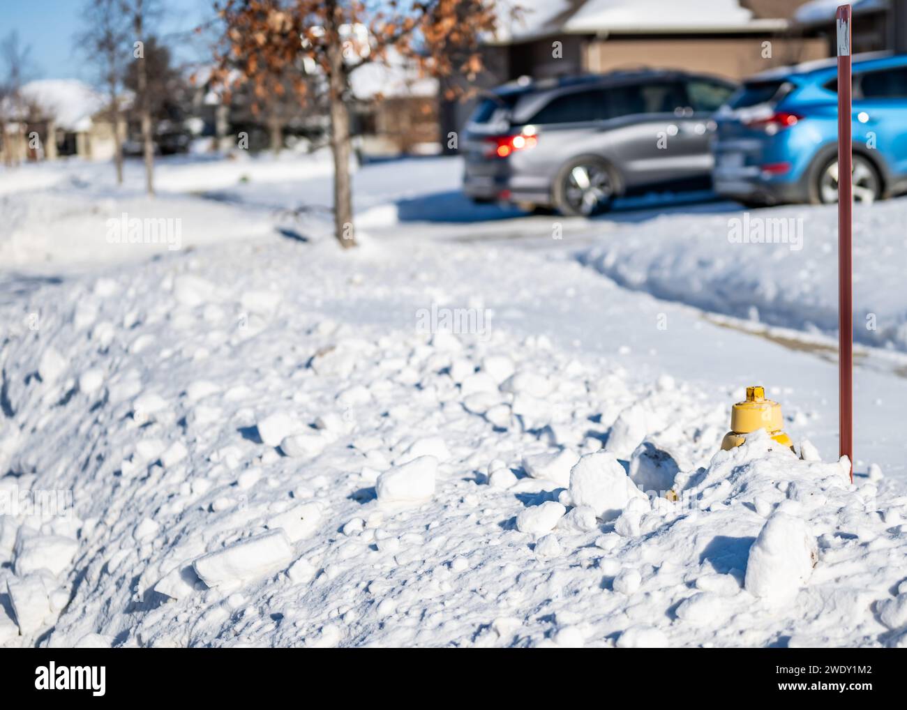 Snow covered fire hydrant with marker on residential street Stock Photo ...