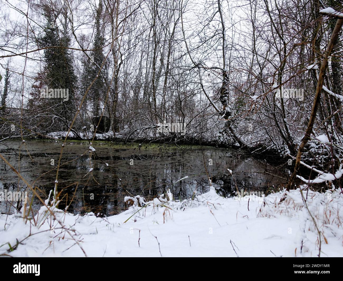 Aerial shot of snow-covered river, captured from a low water level ...