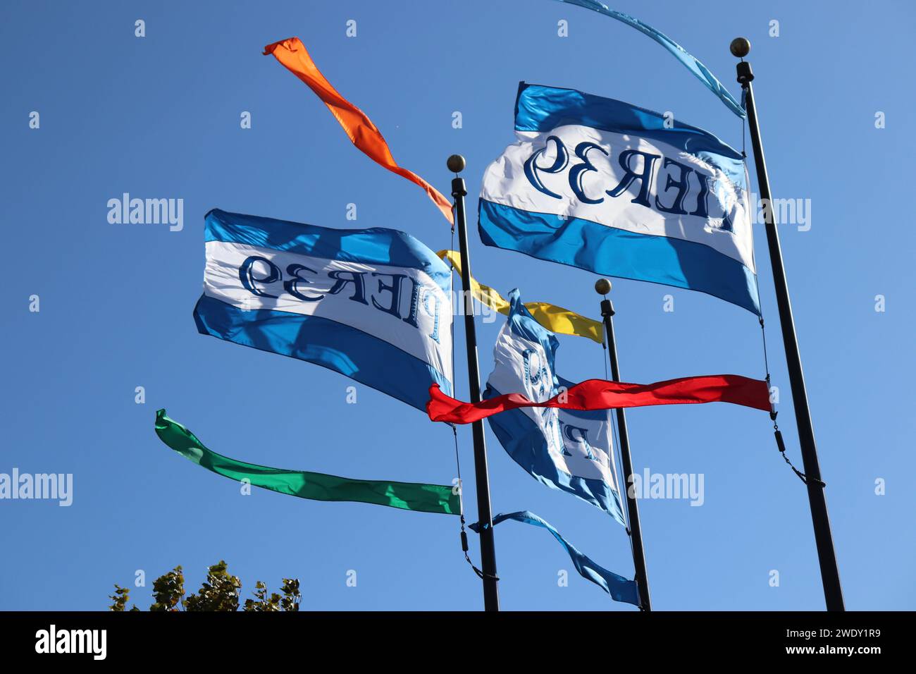 Pier 39's lively flagscape Stock Photo - Alamy