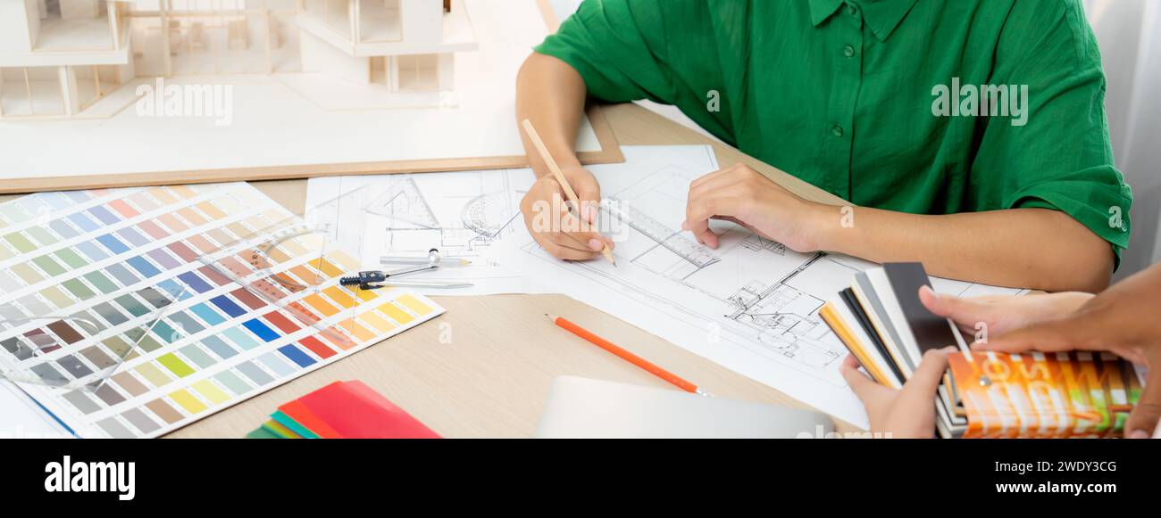 Professional architect drafts blueprint from project manager advice on ...