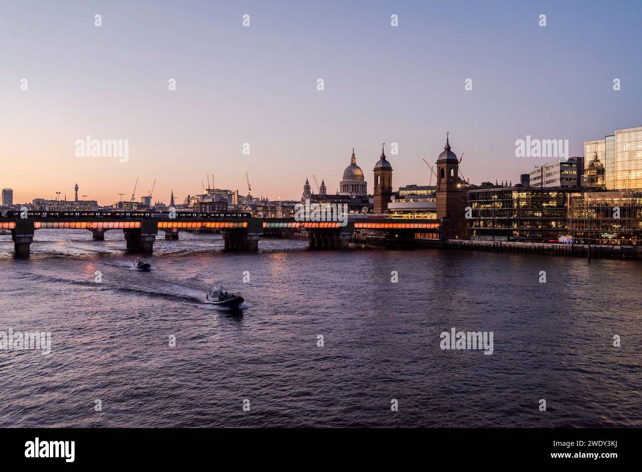 Cannon Street railway bridge illuminated at night, London, England, UK ...