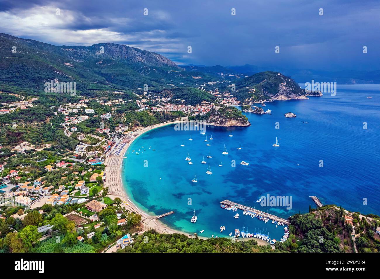 Aerial view (drone) of Valtos beach with picturesque Parga town (and ...