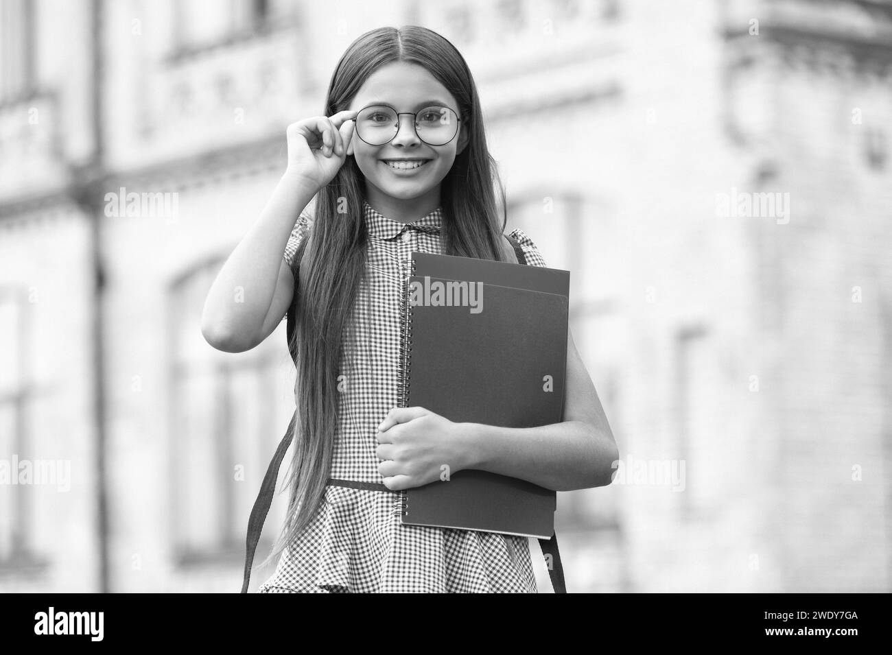 happy school girl at september outdoor. photo of school girl at ...