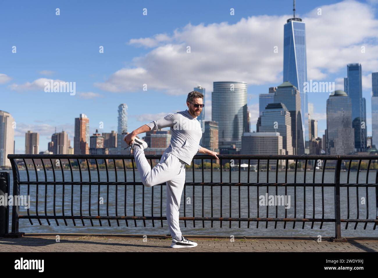 Athlete stretching muscles and preparing for workout. Stretching ...