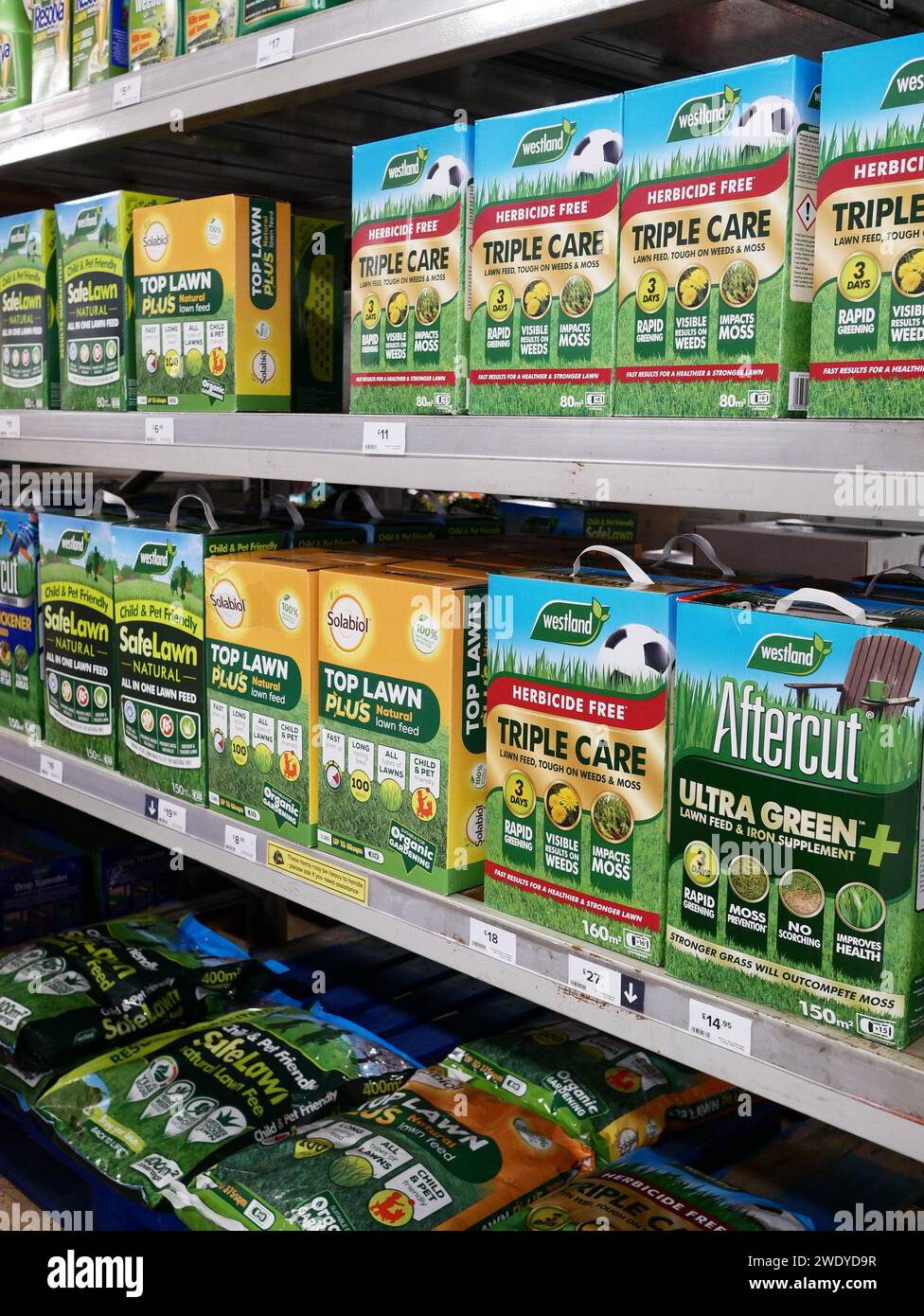 Lawn care products for sale in the garden section of a DIY store. UK ...