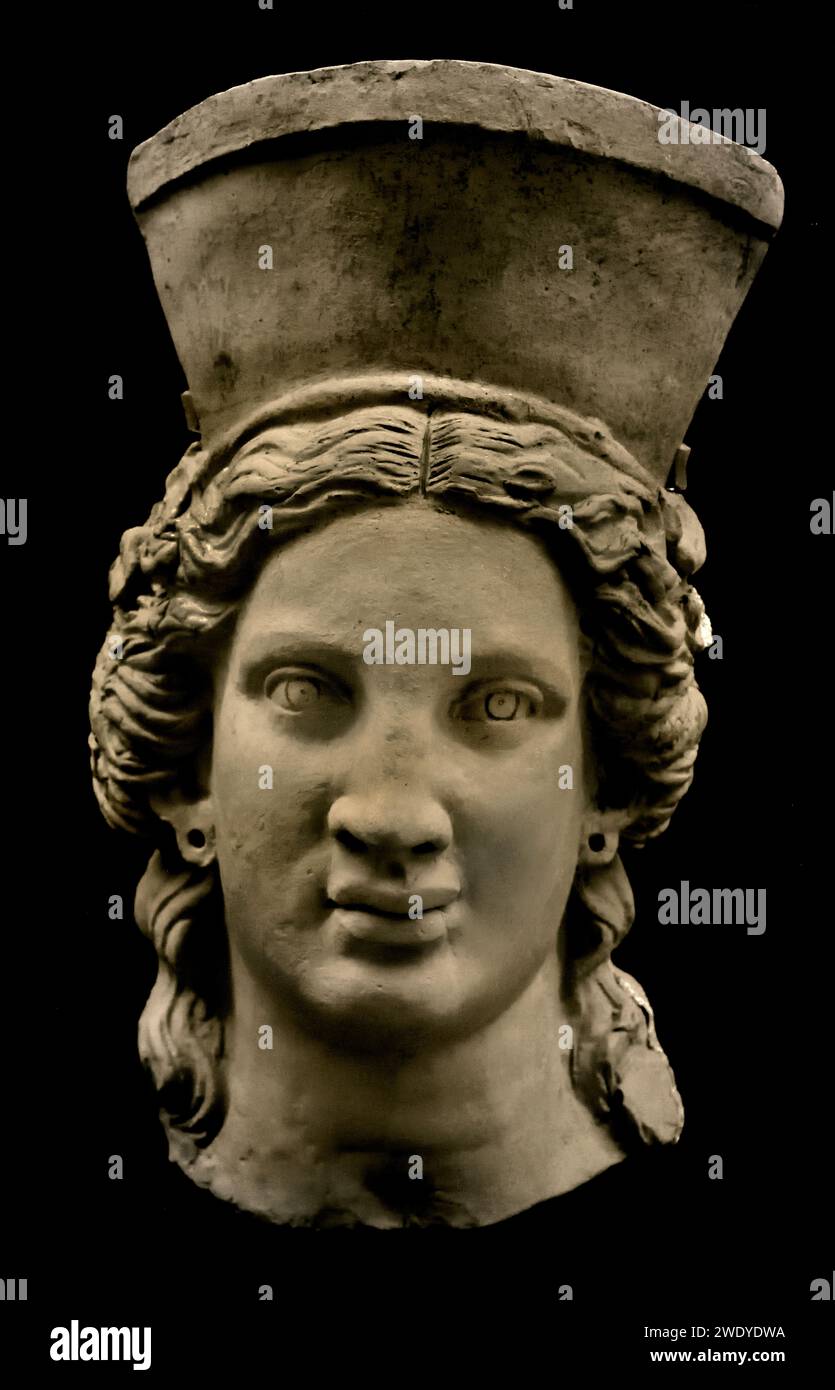 Terracotta votive bust of a goddess with a high polos and floral wreath ...