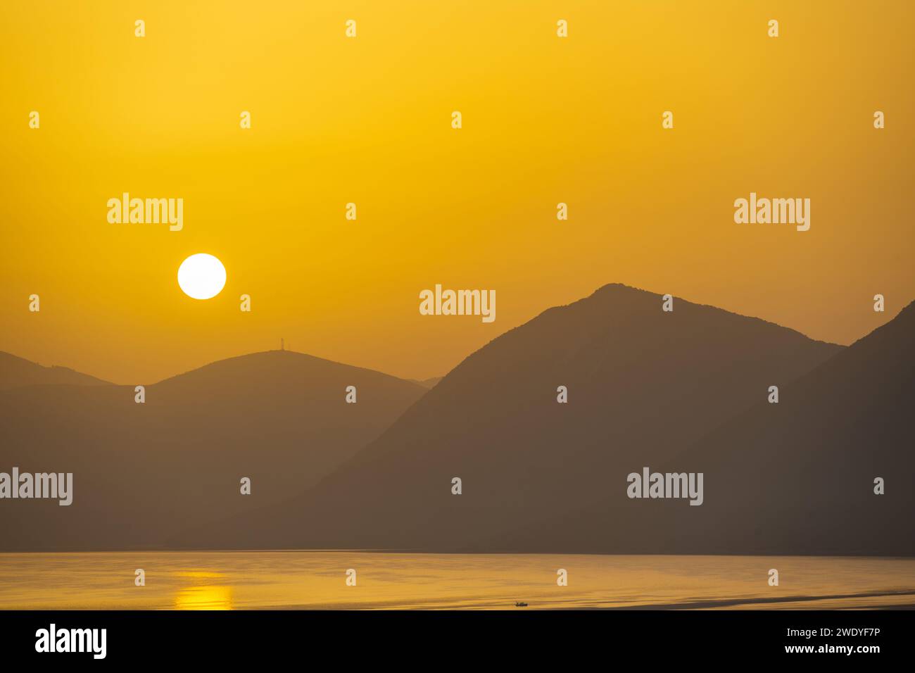 Dawn breaking behind the mountains of Mainland Greece from the Island ...