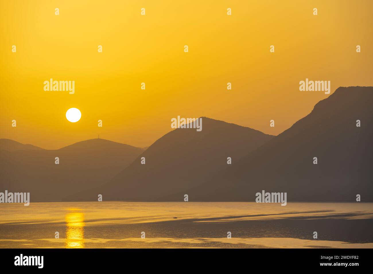 Dawn breaking behind the mountains of Mainland Greece from the Island ...